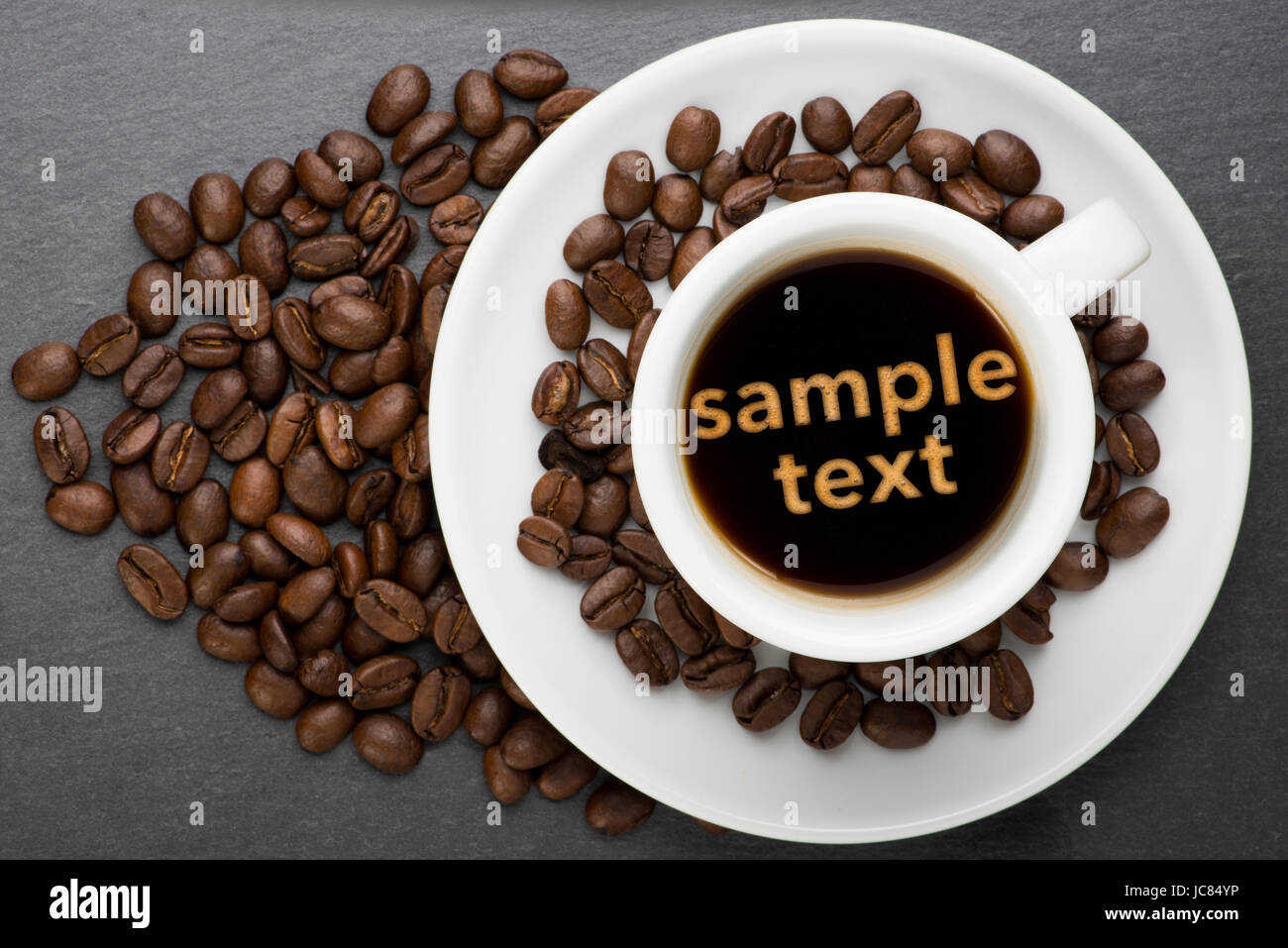 Cup of coffee with sample text point with bean Stock Photo - Alamy
