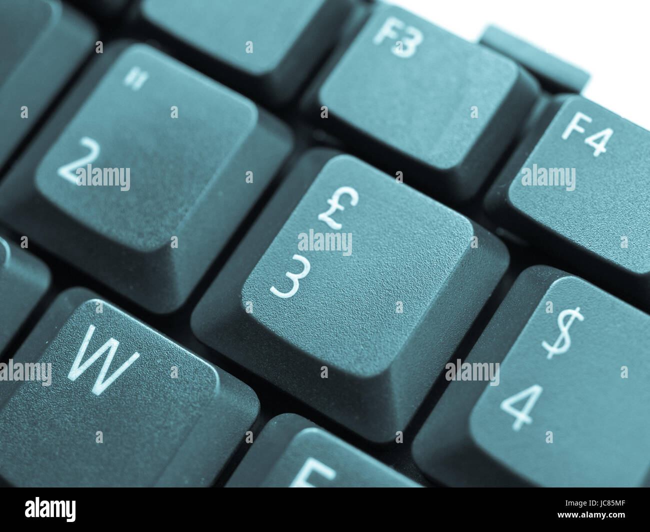 Detail of keys on a computer keyboard - cool cyanotype Stock Photo - Alamy