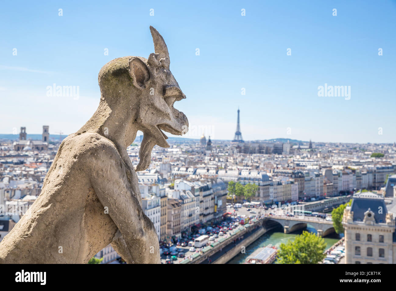 Gargoyle Stryge and demon at Notre Dame of Paris overlooking the ...