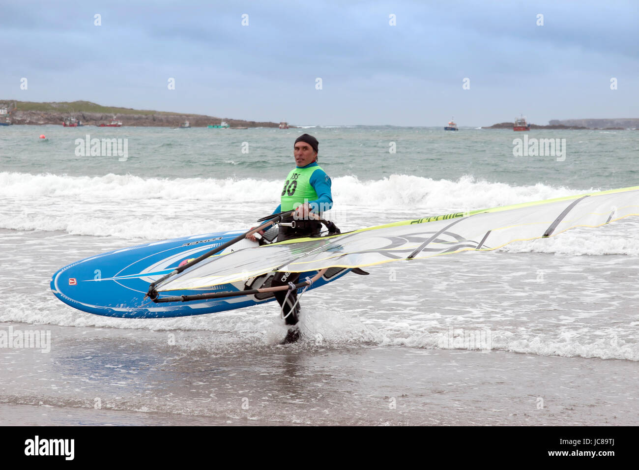 windsurfers getting ready to race and surf on the beach in the maharees ...