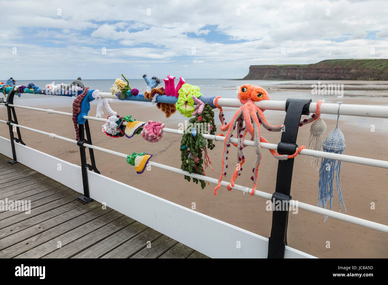 Colourful knitted sea creatures attached to the pier at Saltburn by the ...