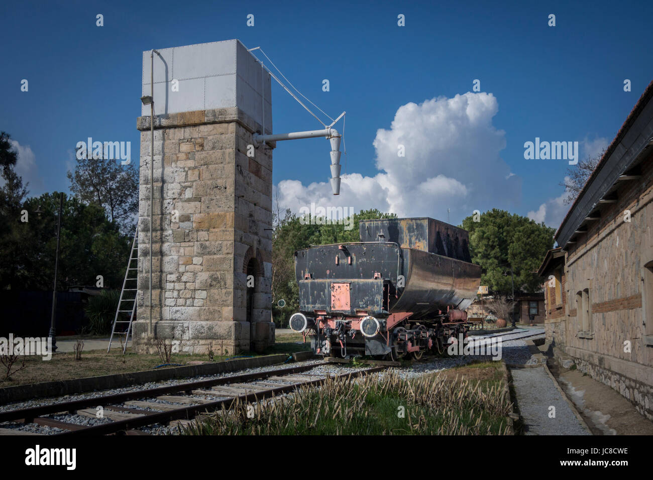 Old Steam Locomotive under a water tank outlet pipe, located in Museum ...