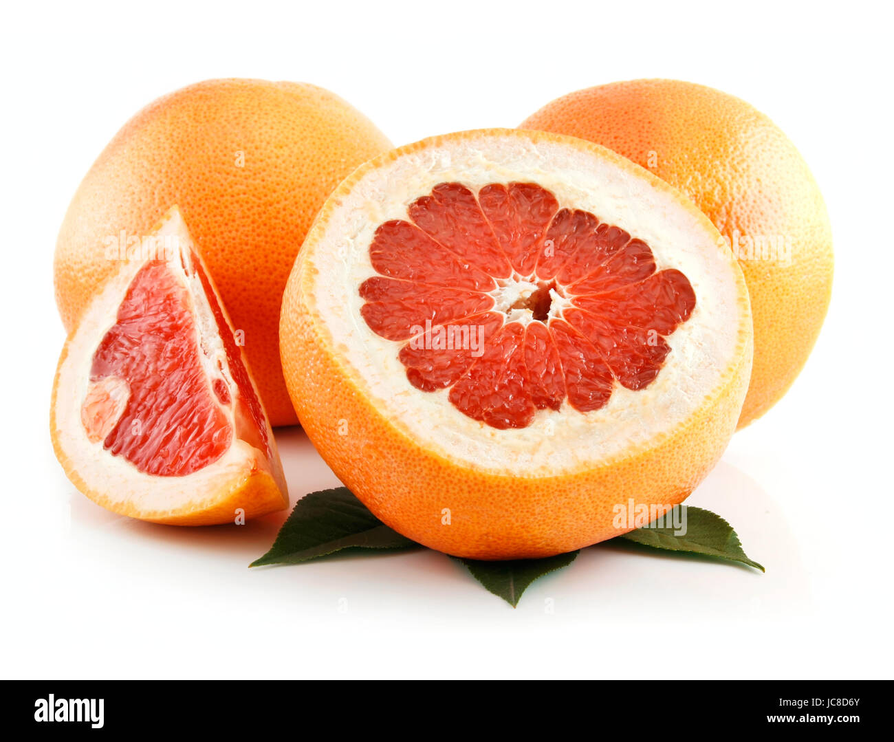 Ripe Sliced Grapefruit with Leaves Isolated on White Background Stock ...