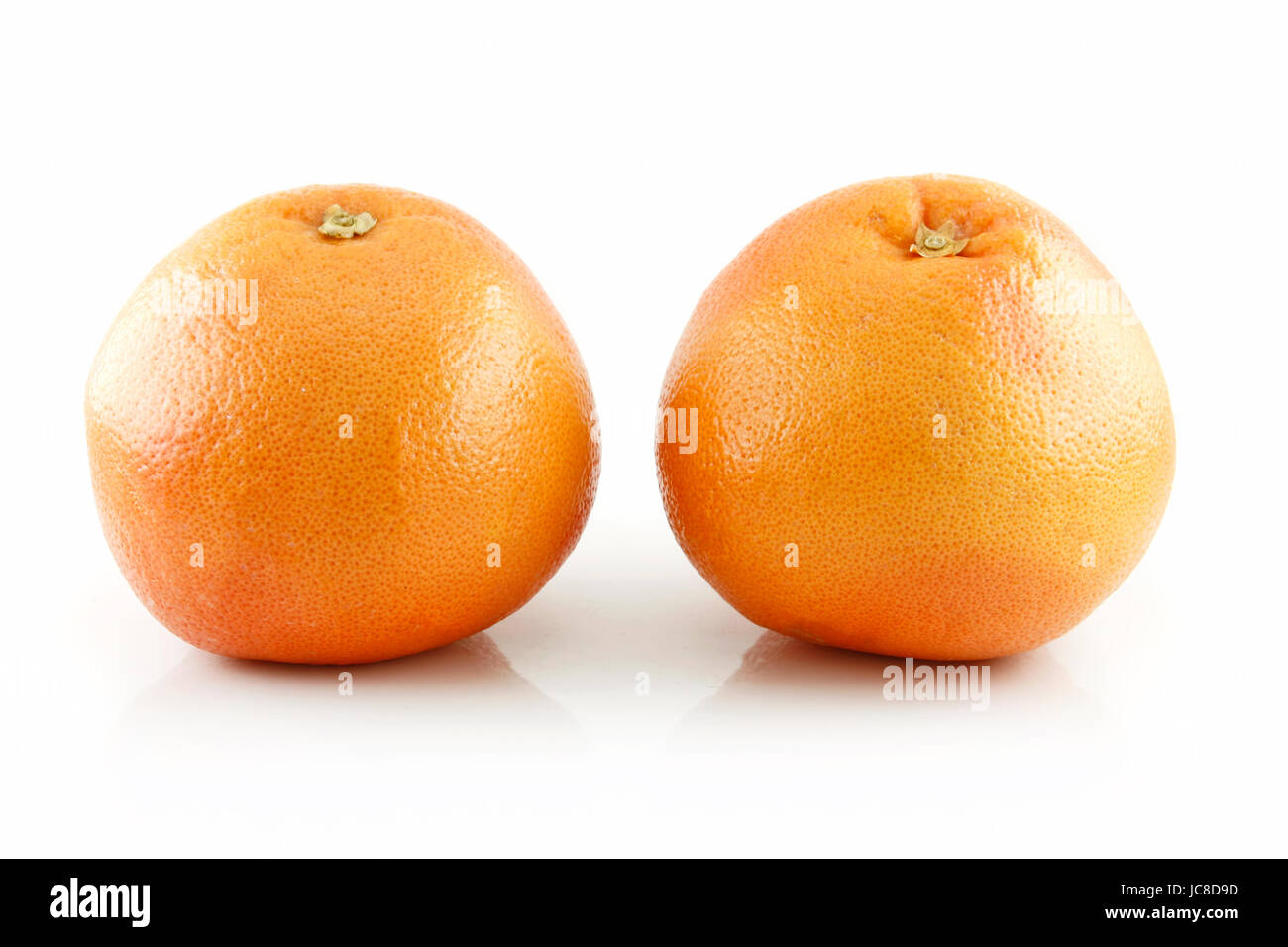 Two Ripe Wet Grapefruits with Leaves Isolated on White Background Stock ...