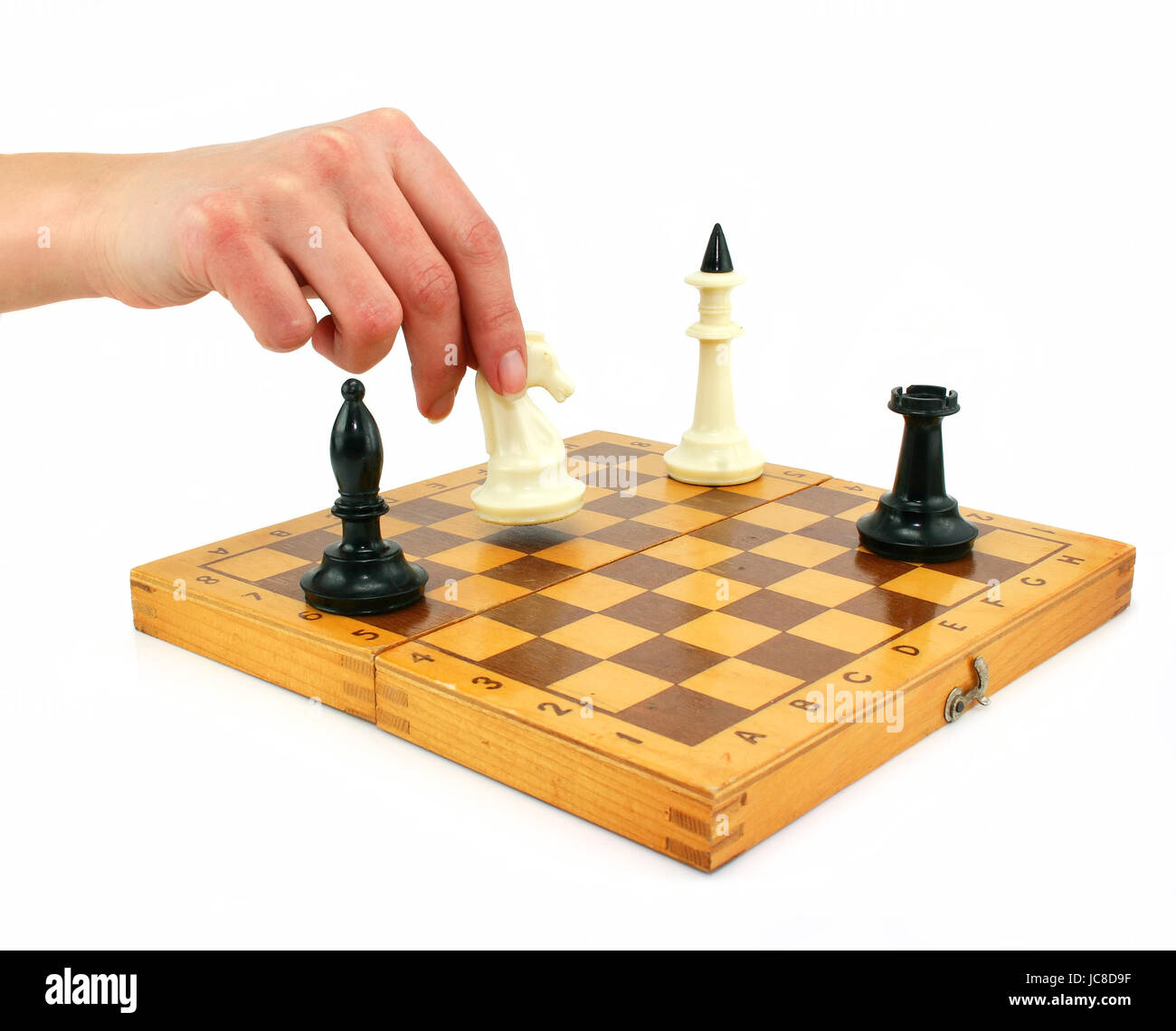 Chessboard and female hand gives check isolated on a white background ...