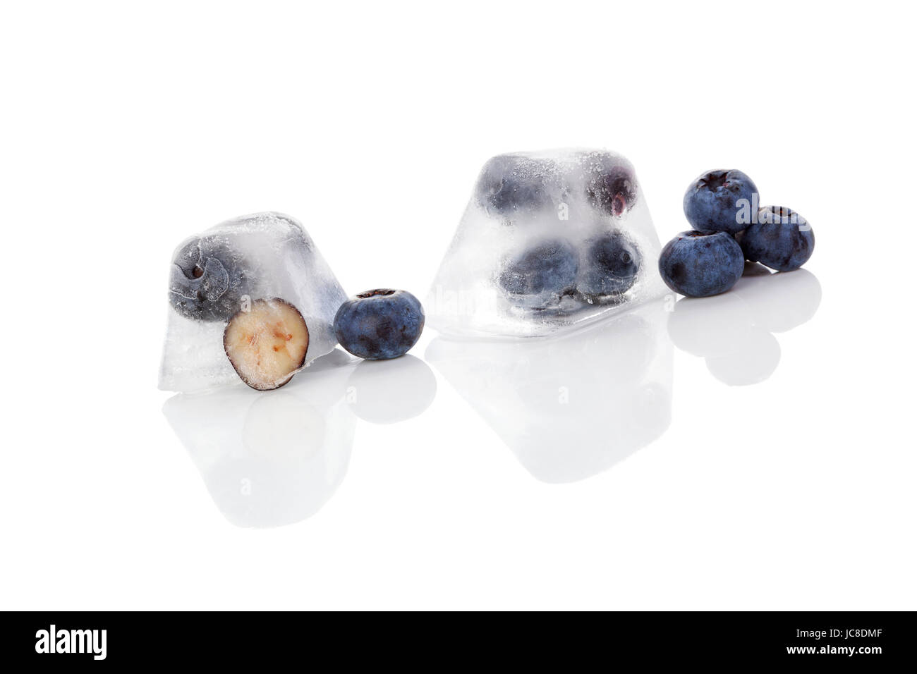 Blueberries frozen in ice cubes isolated on white background. Fresh ...