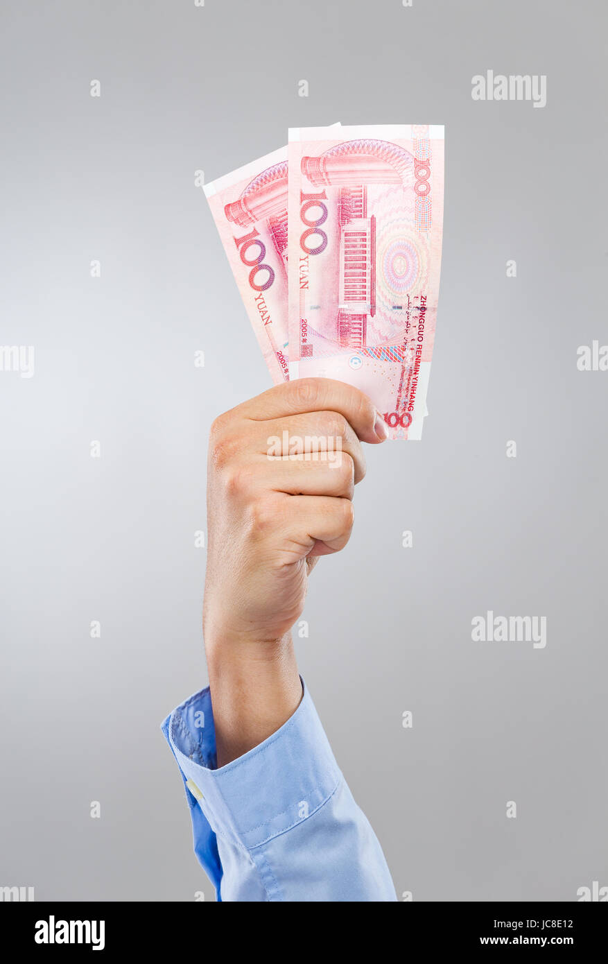 Hand renminbi banknote hi-res stock photography and images - Alamy