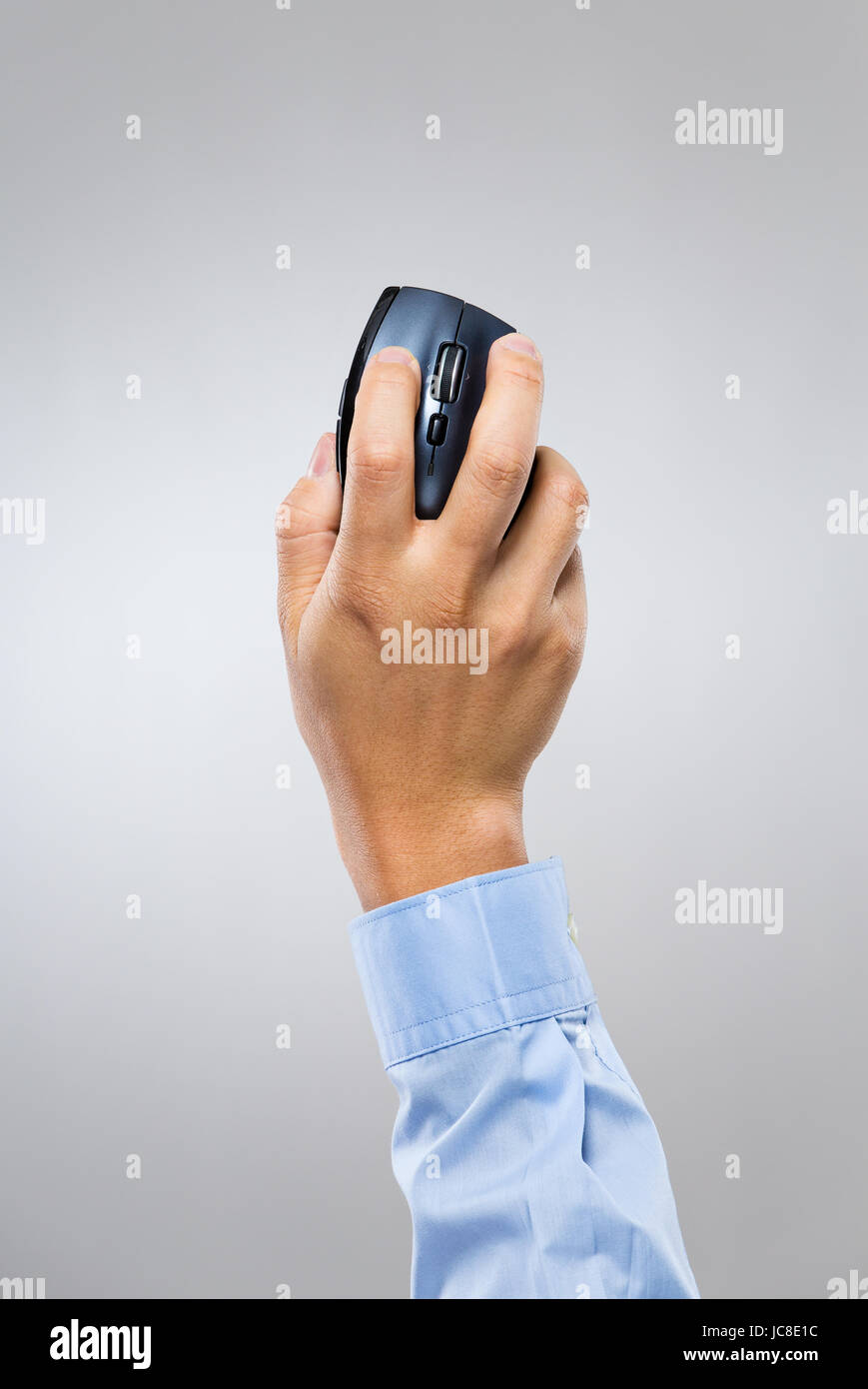 Businessman hand holding mouse Stock Photo - Alamy
