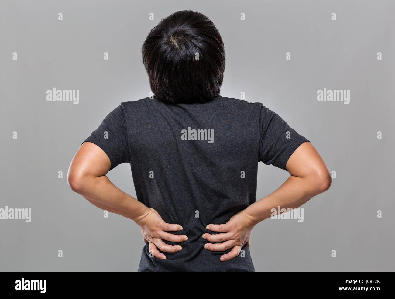 Man with back pain Stock Photo - Alamy