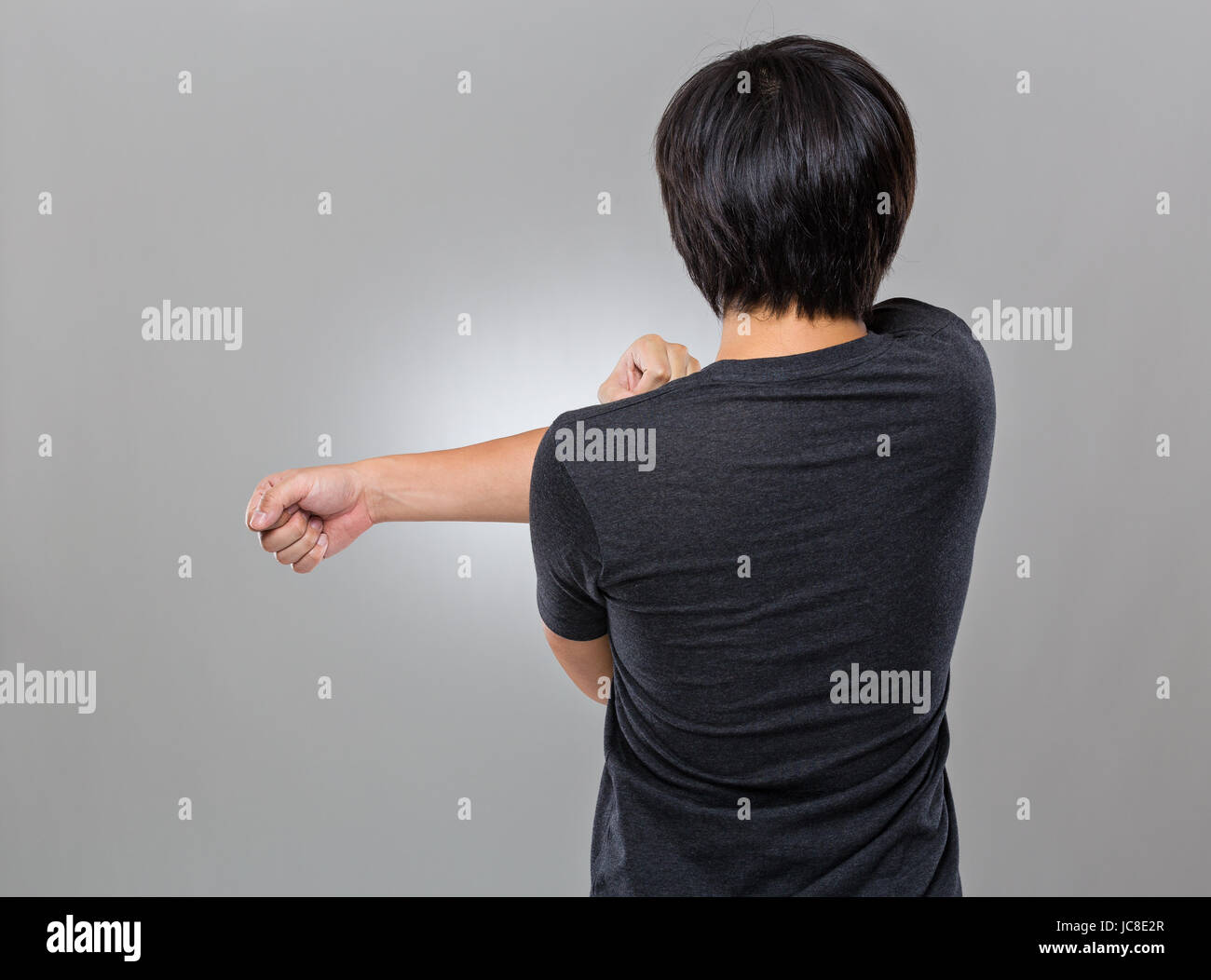 Man stretching arm Stock Photo - Alamy