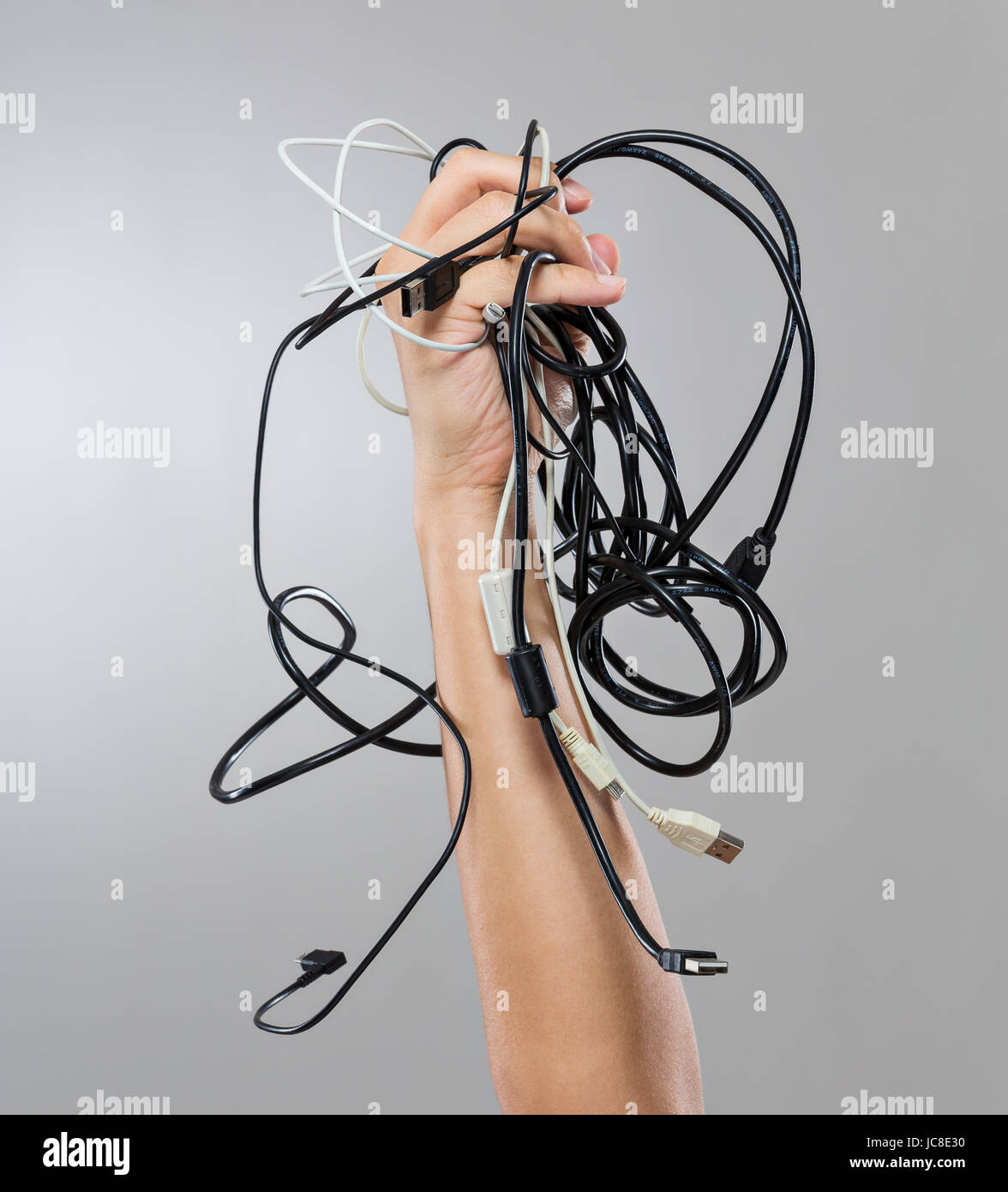 Male hand hold with lots of cable cords Stock Photo - Alamy