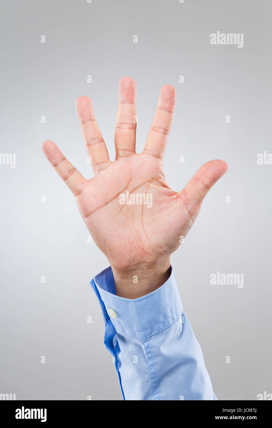 Businessman hand gesture show number five Stock Photo - Alamy
