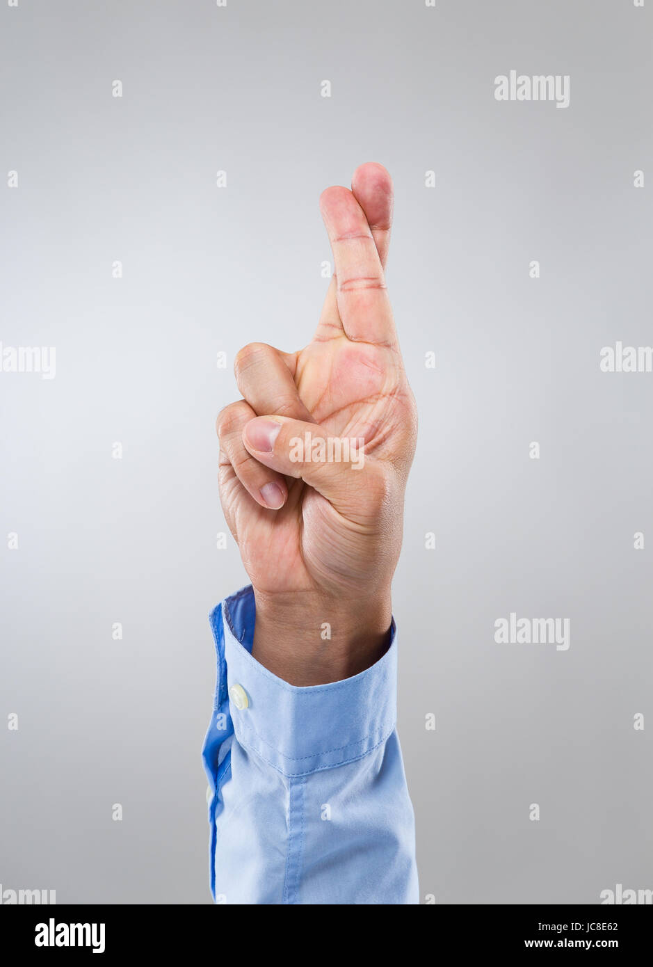 Businessman hand with finger cross Stock Photo - Alamy