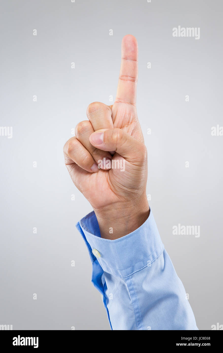 Businessman hand gesture show number one Stock Photo - Alamy