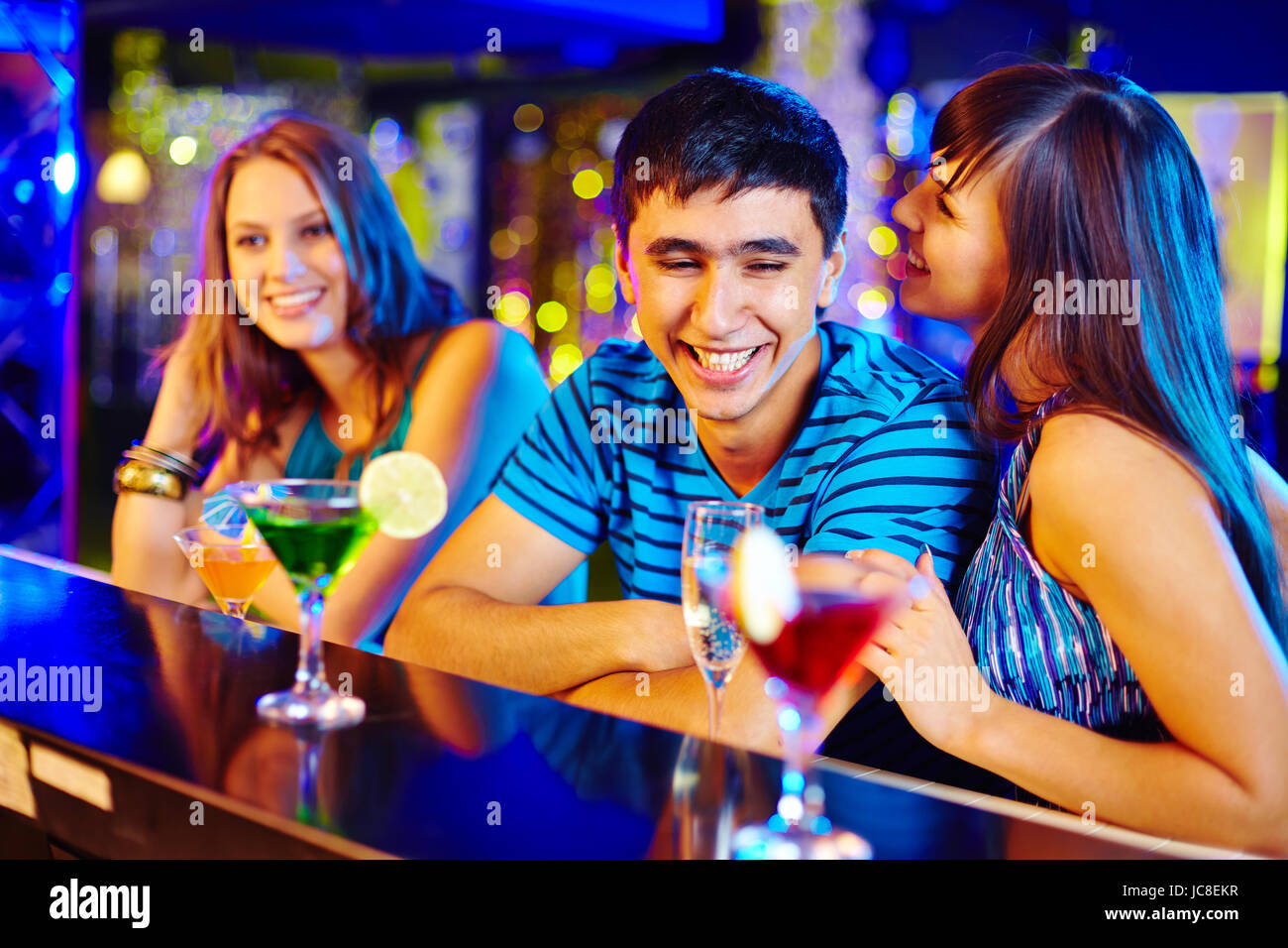 Portrait of pretty girl flirting with guy at party in the bar Stock ...