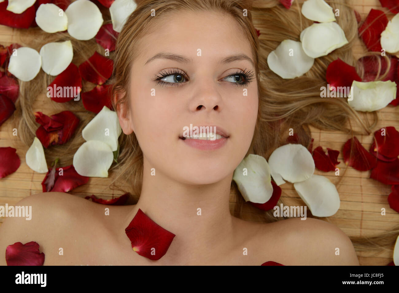 woman on rose petals Stock Photo - Alamy