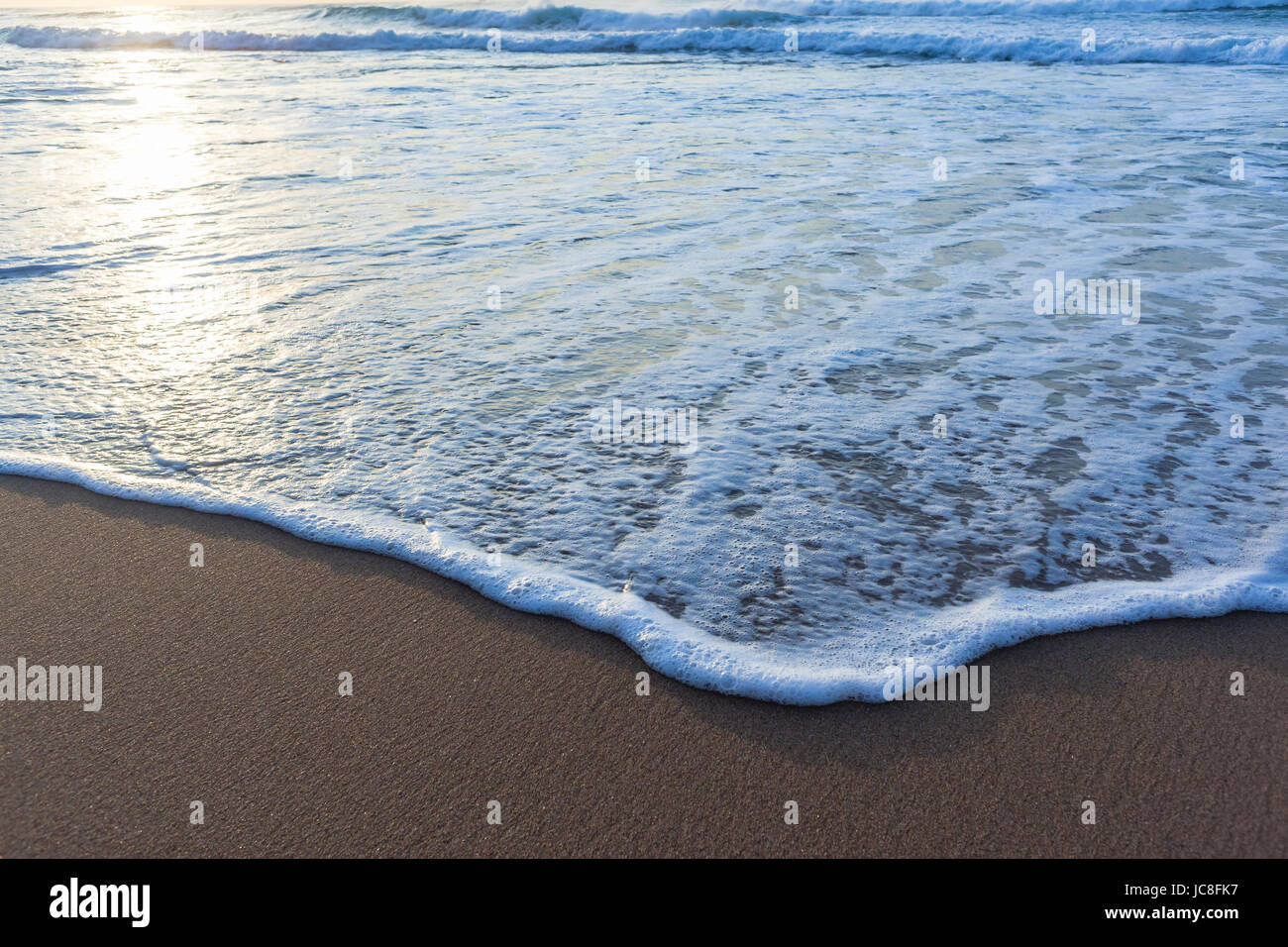 Beach morning wave wash up sand shoreline nature water detail contrasts ...