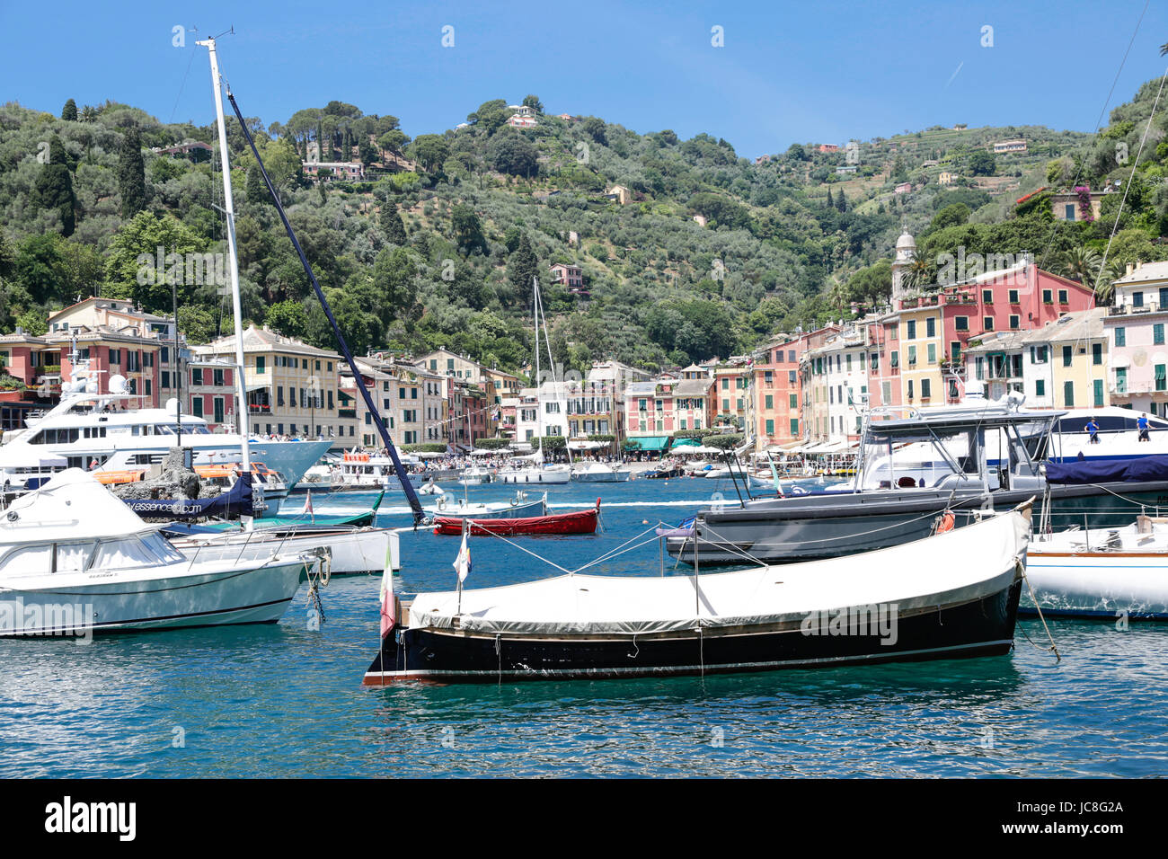 Portofino harbor with colorful and historical houses in the background ...