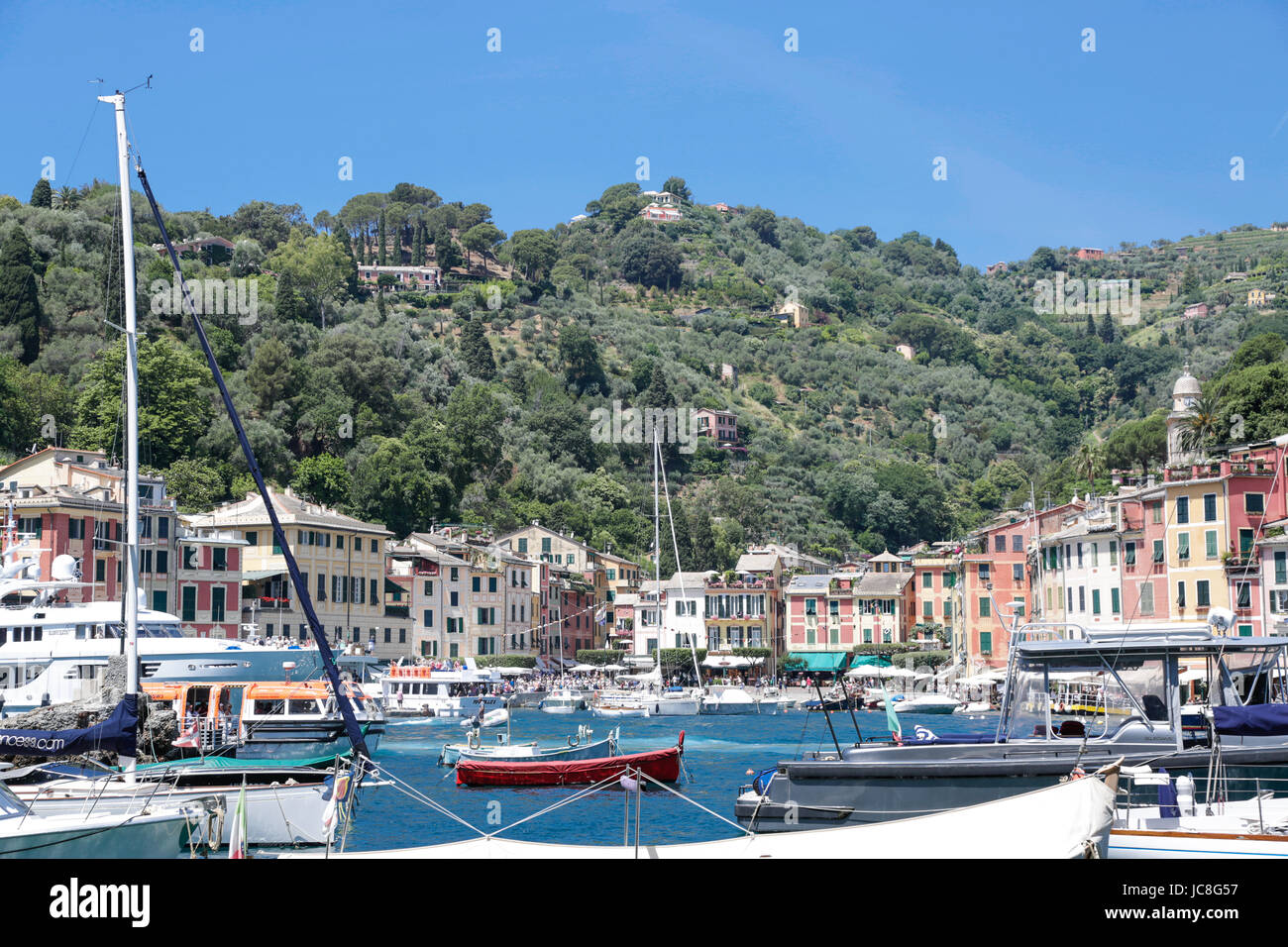 Portofino harbor with colorful and historical houses in the background ...