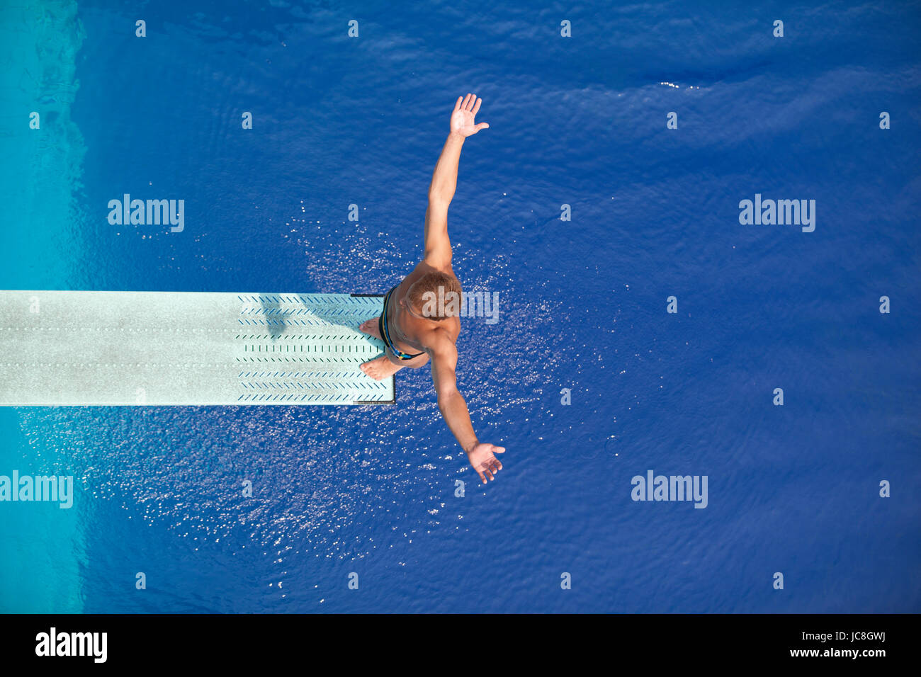 preparing to dive into a swimming pool Stock Photo - Alamy