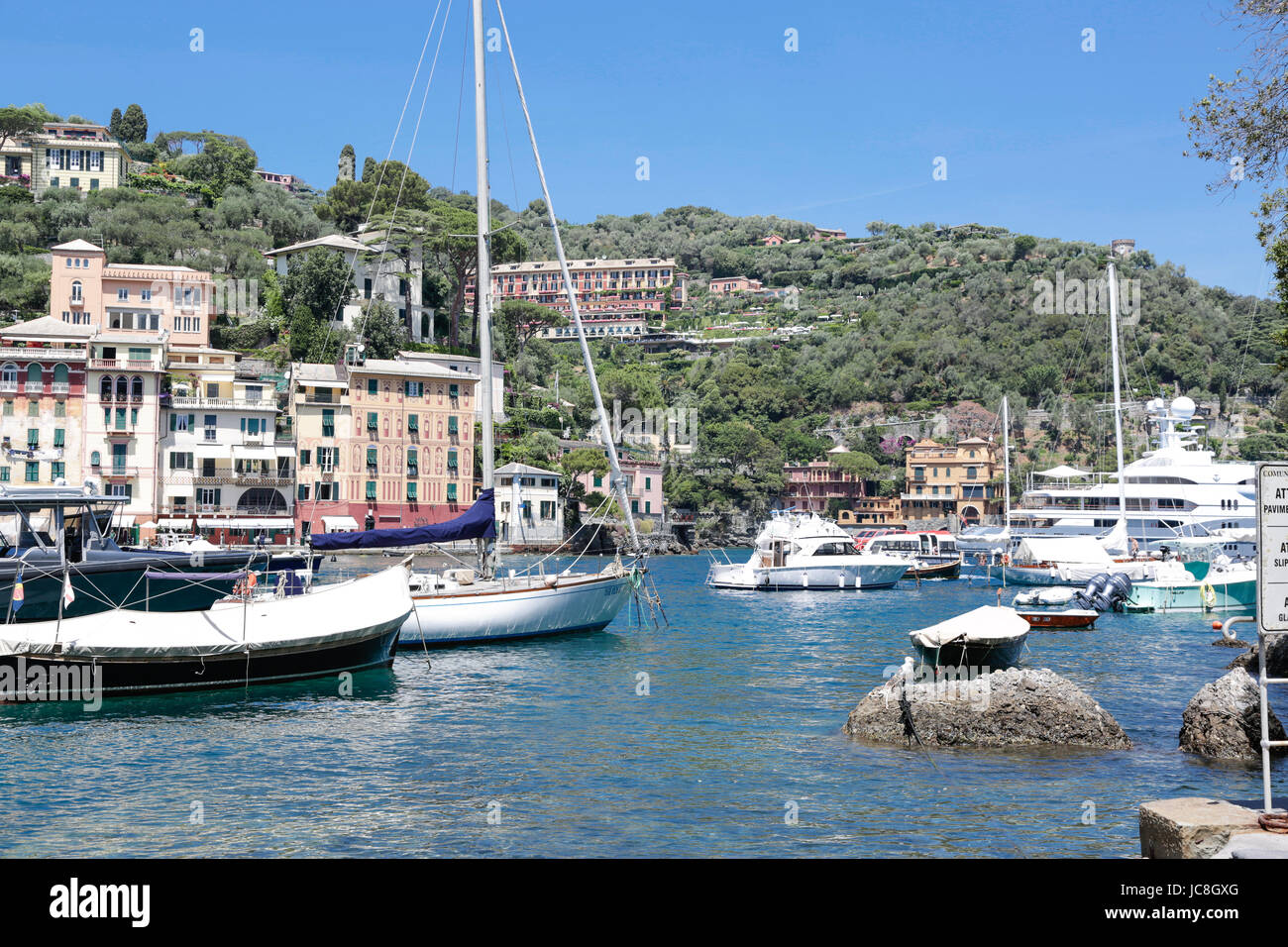 Portofino harbor with colorful and historical houses in the background ...