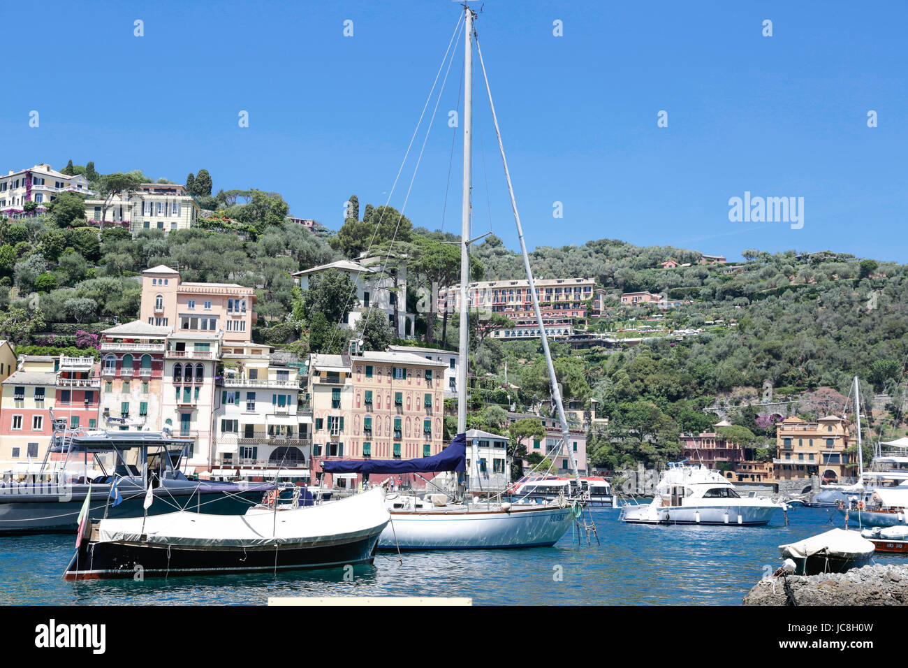 Portofino harbor with colorful and historical houses in the background ...