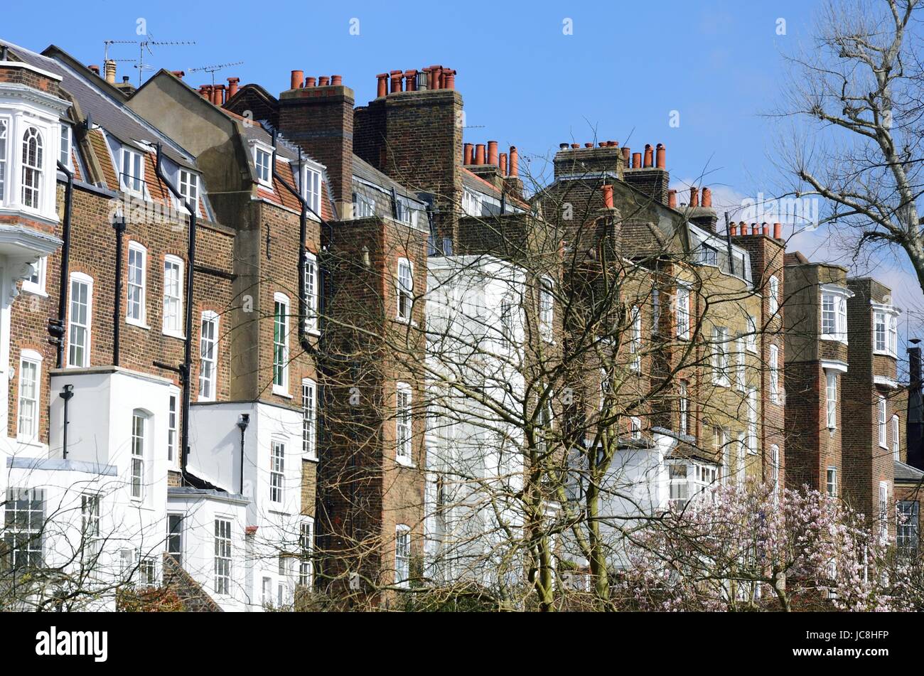 Row of large English Townhouses Stock Photo - Alamy