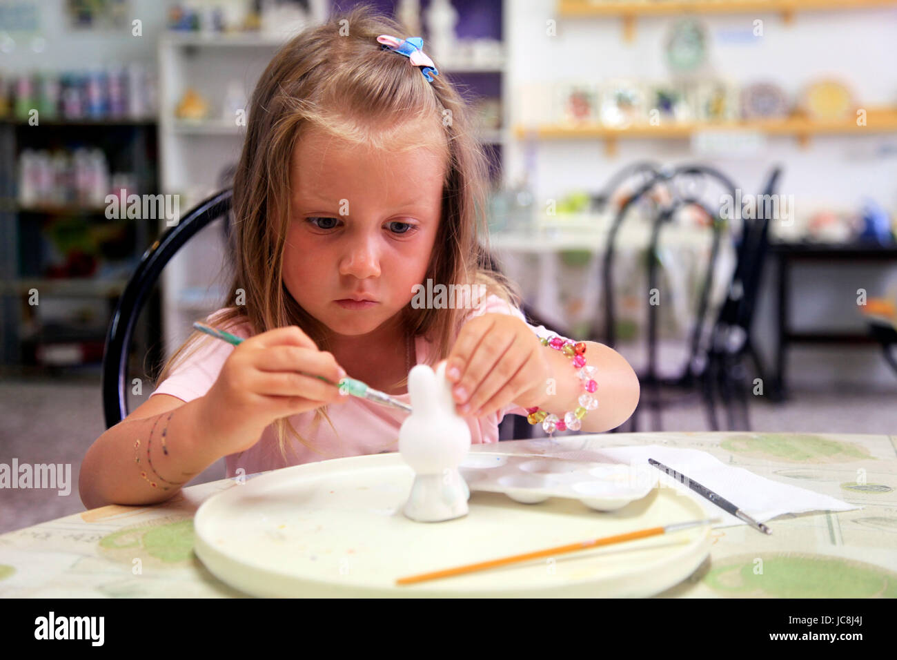 Little girl is engaged in creativity Stock Photo - Alamy