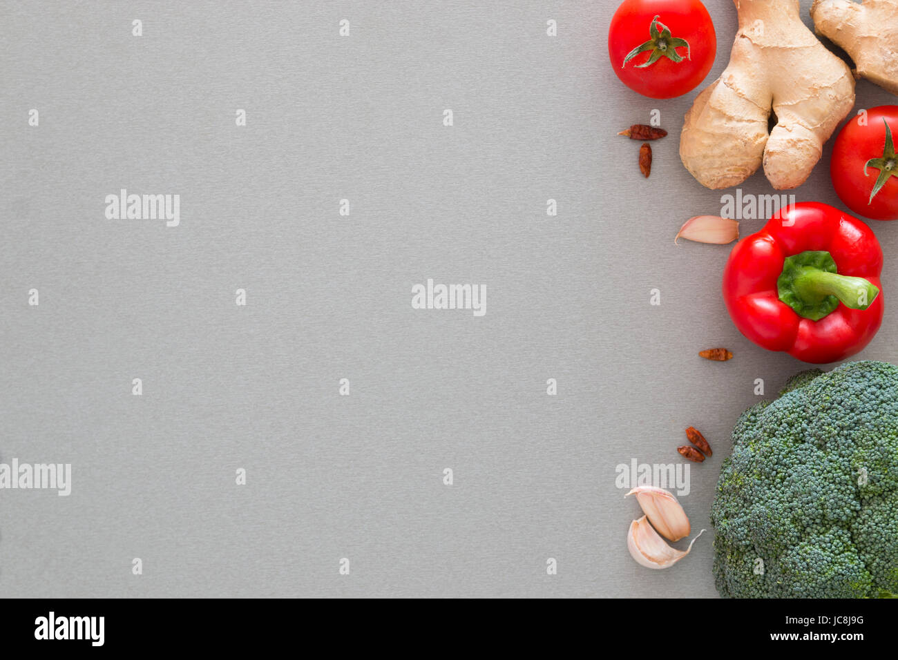 Fresh vegetables on grey background. Food background Stock Photo - Alamy