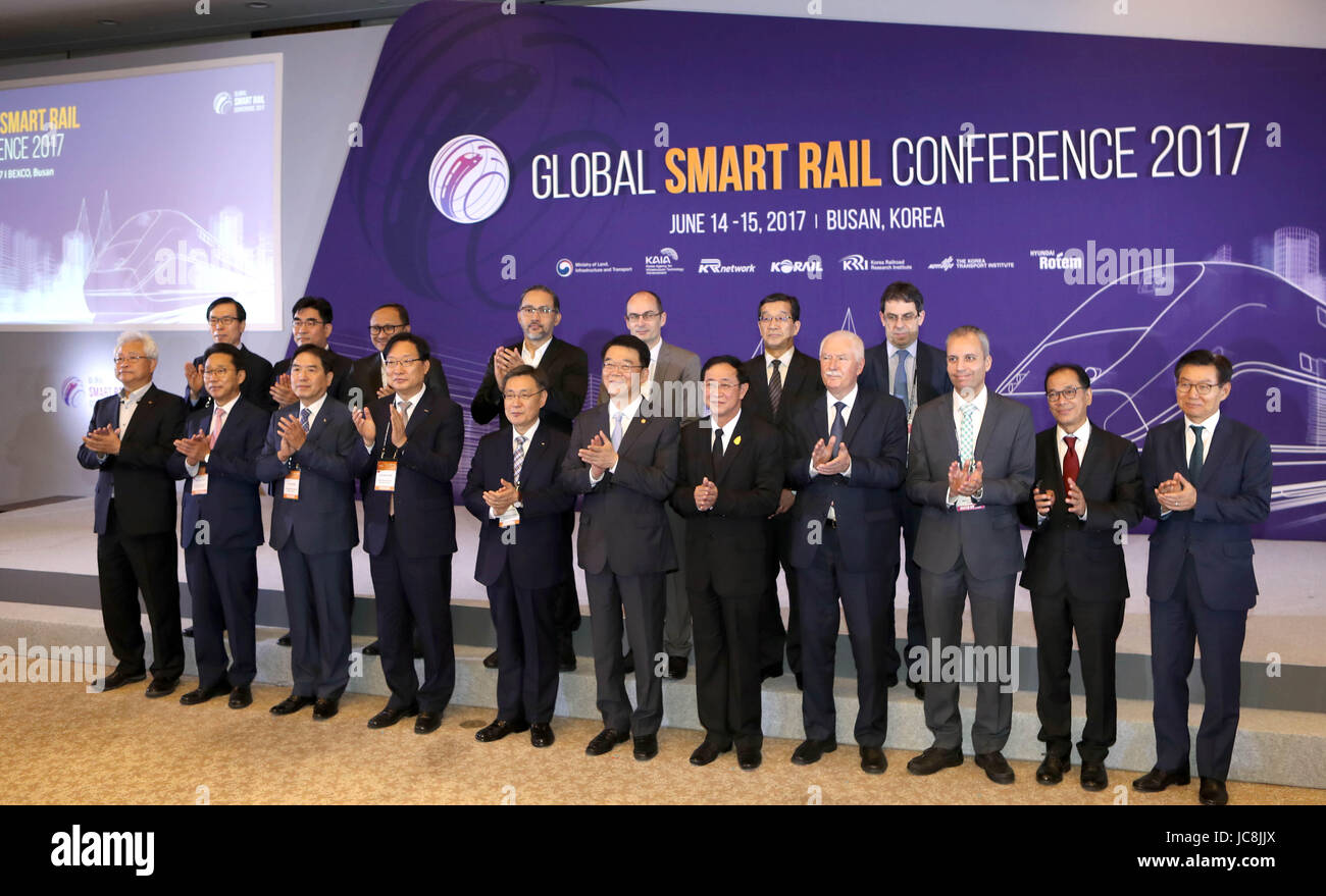 Int'l smart rail confab Participants pose at the opening ceremony of ...