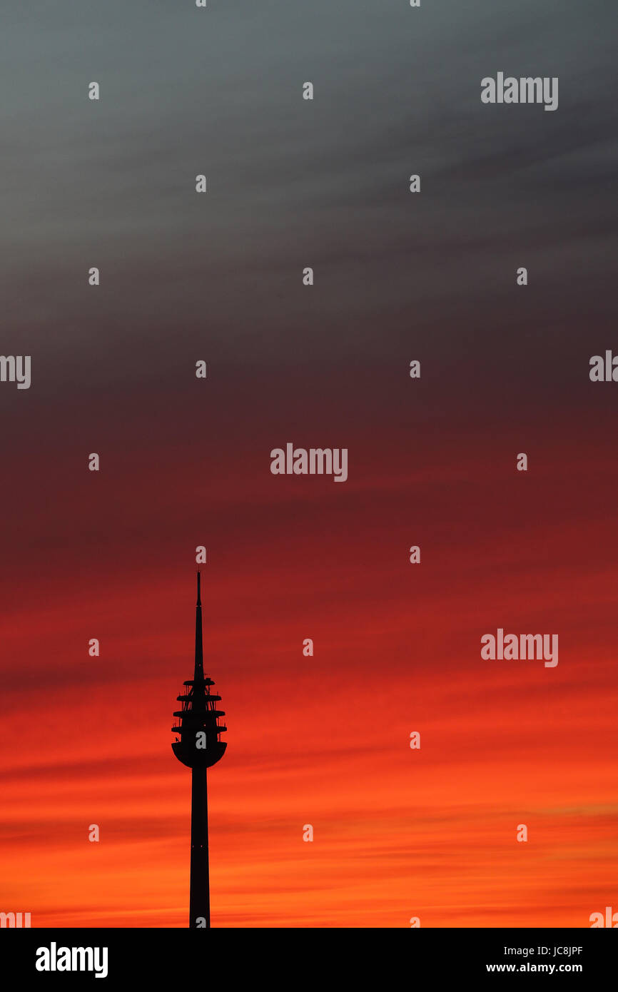 The TV tower can be seen against a blood red evening sky in Nuremberg ...
