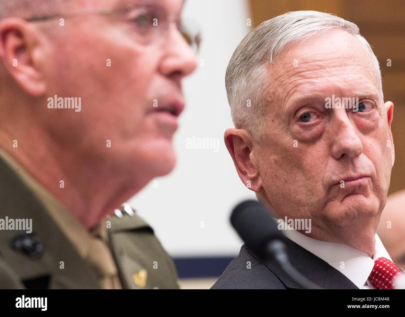 U.S. Secretary of Defense Jim Mattis, right, looks on as Chairman of ...