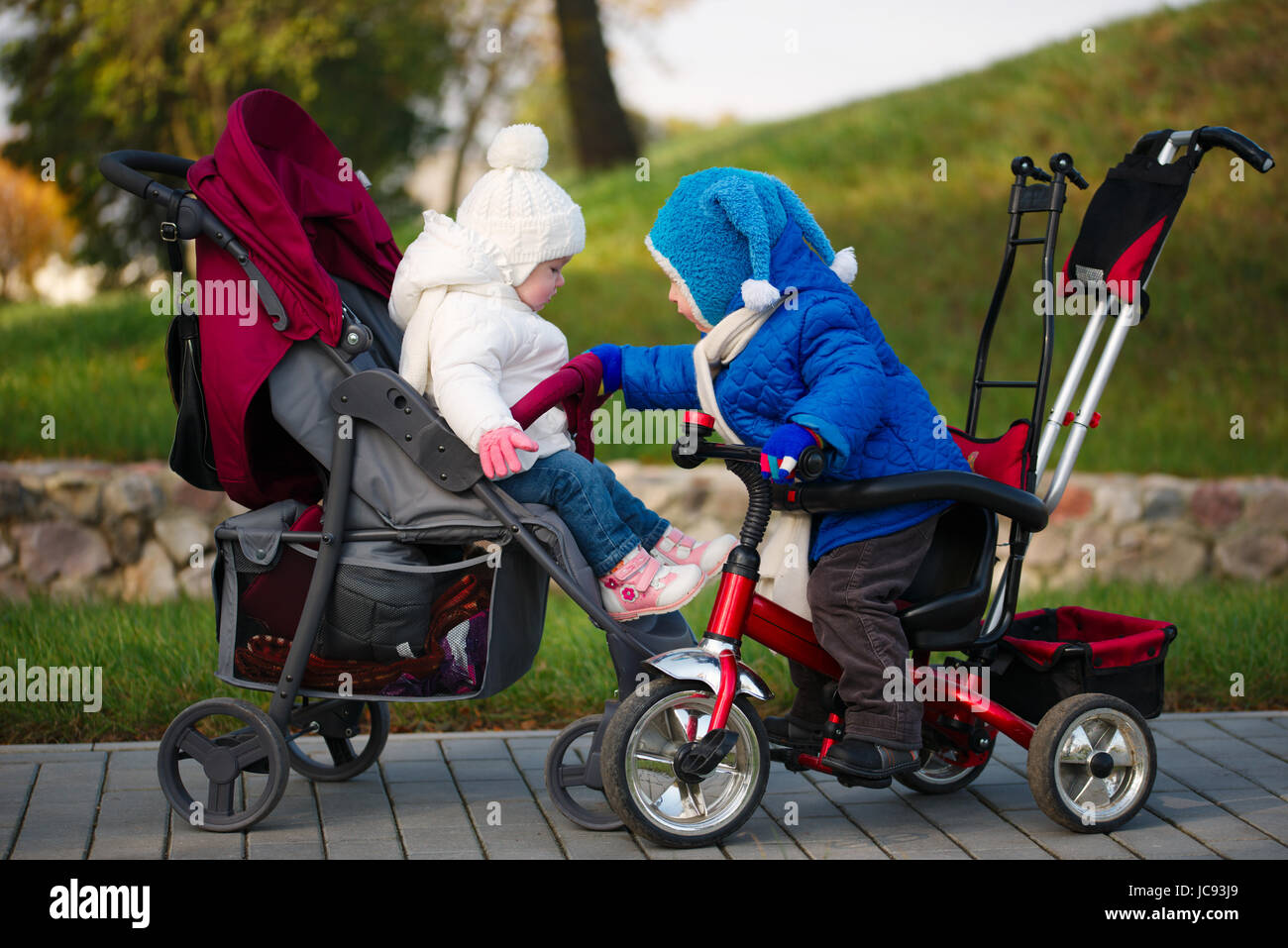 boy and girl met in strollers Stock Photo - Alamy