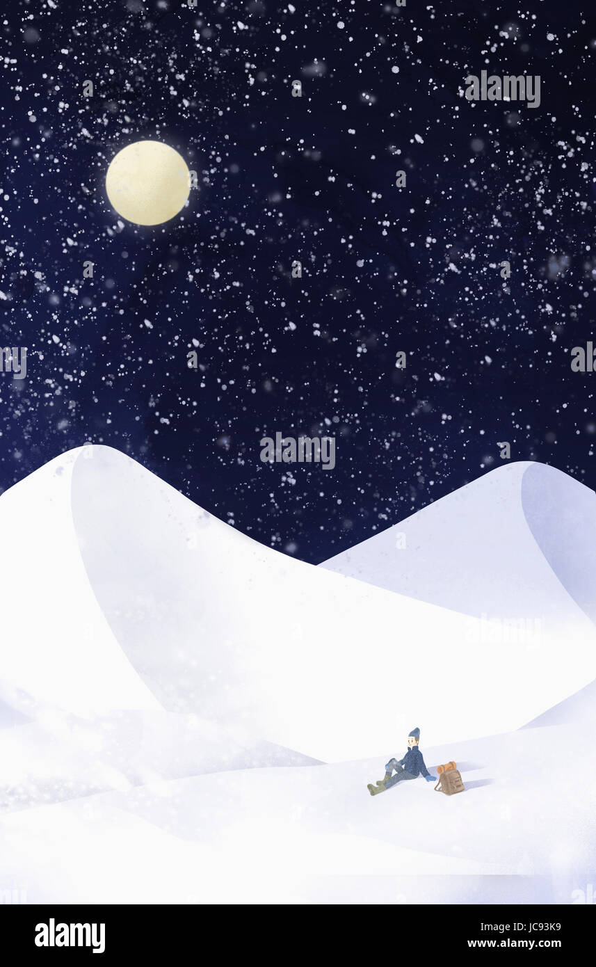 Man sitting in snowy field at night Stock Photo - Alamy