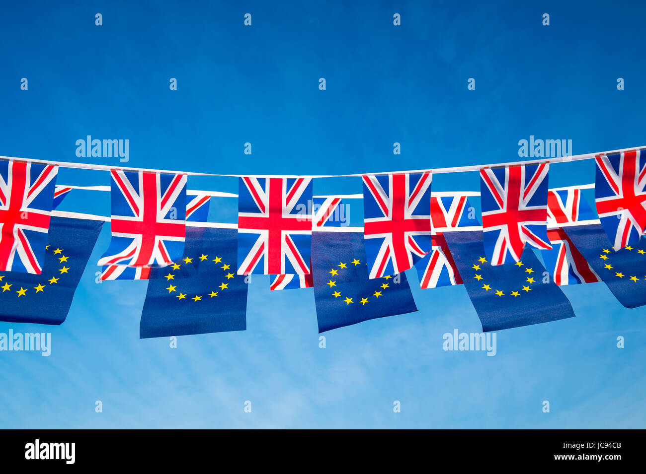 European Union and British Union Jack flag bunting flying in bright ...