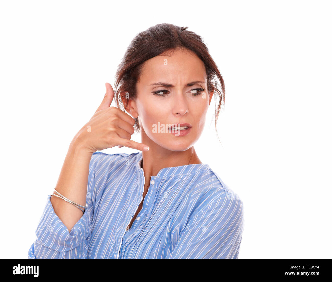 Portrait of angry adult lady wondering with call gesture while looking ...