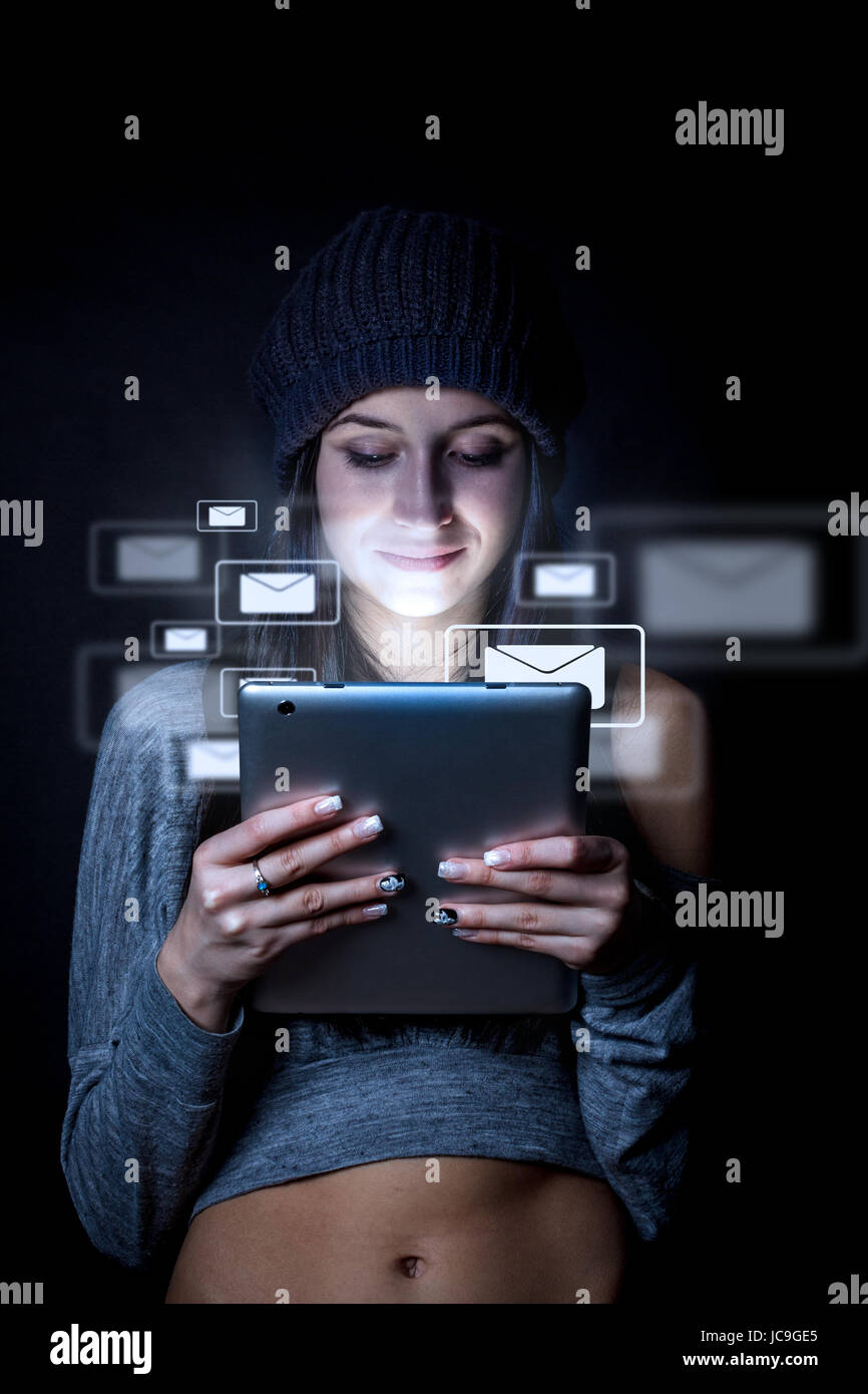 Young girl with tablet using social media Stock Photo - Alamy