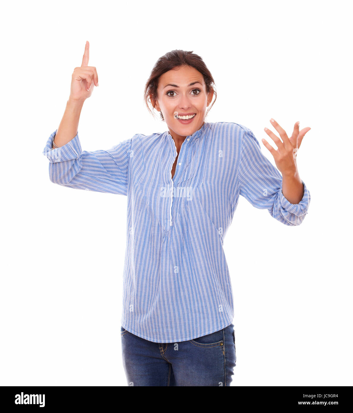 Portrait of surprised single lady pointing up her arm while standing ...