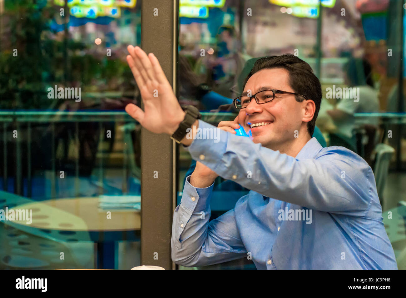 handsome young successful man doing a welcome gesture. Inviting ...
