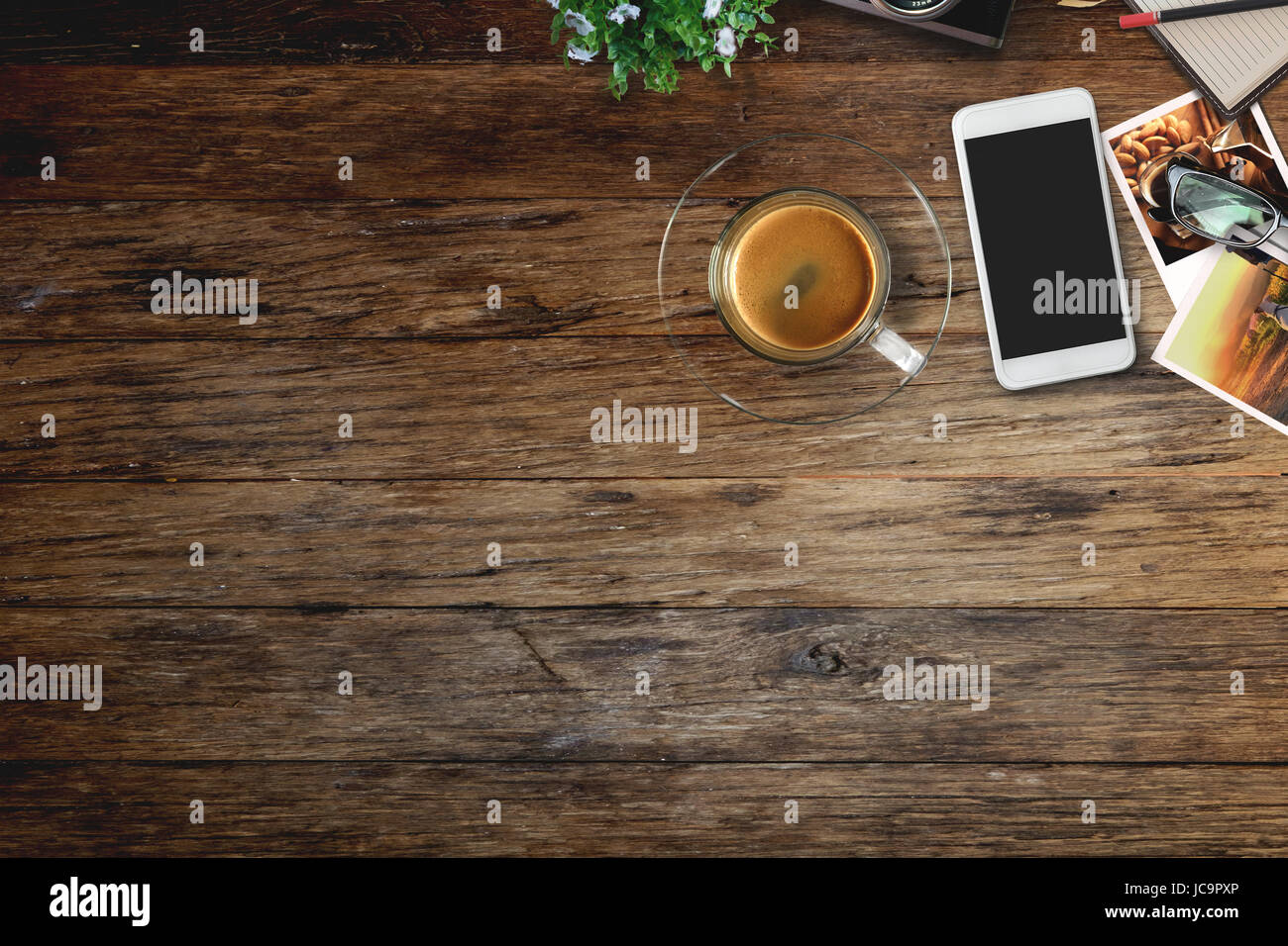 Rustic wood designer desk table with pictures gadget . Top view with ...