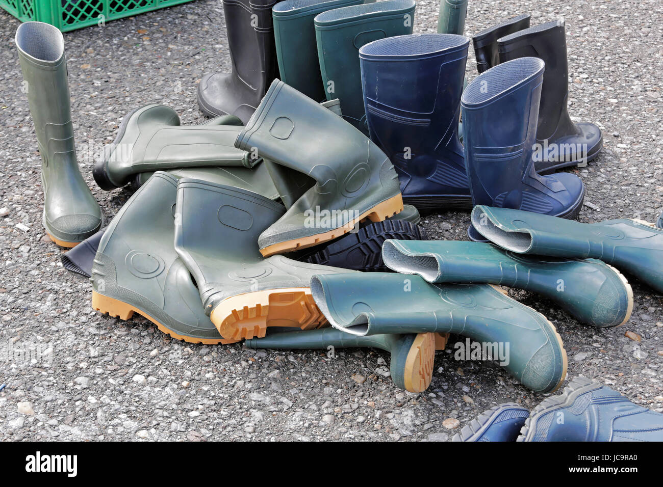 Bunch of rubber Wellington boots outdoor wear Stock Photo - Alamy