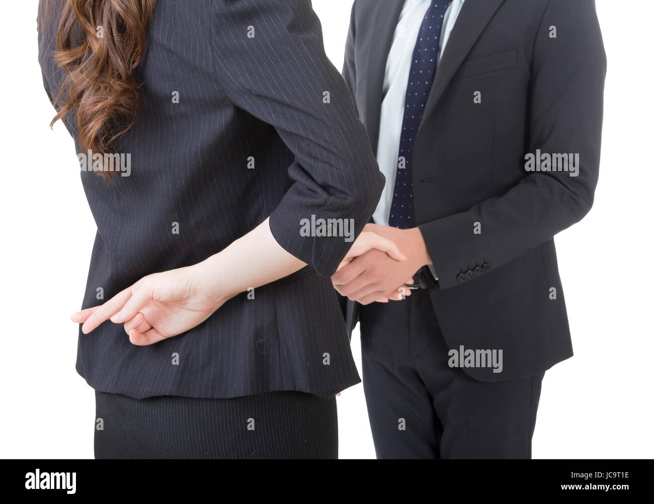 Business woman and man shake hands and put finger cross on back ...