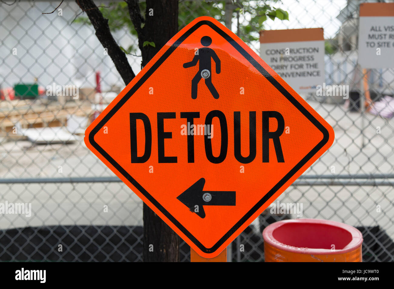 A sign marks a detour on the street in Calgary, Canada. The sign is ...