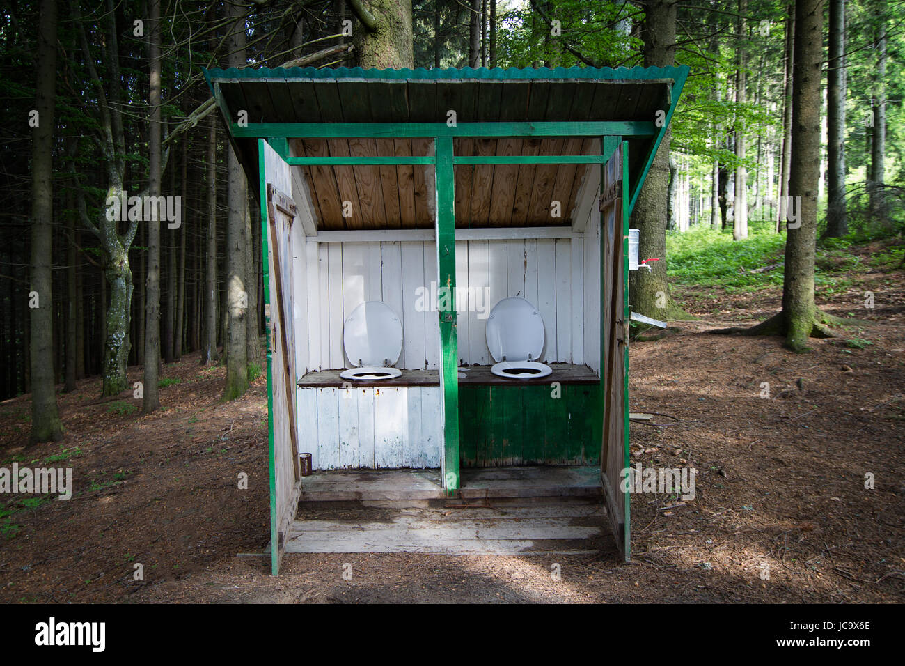 horizontal front view of outdoor toilet booth latrine made of wood ...