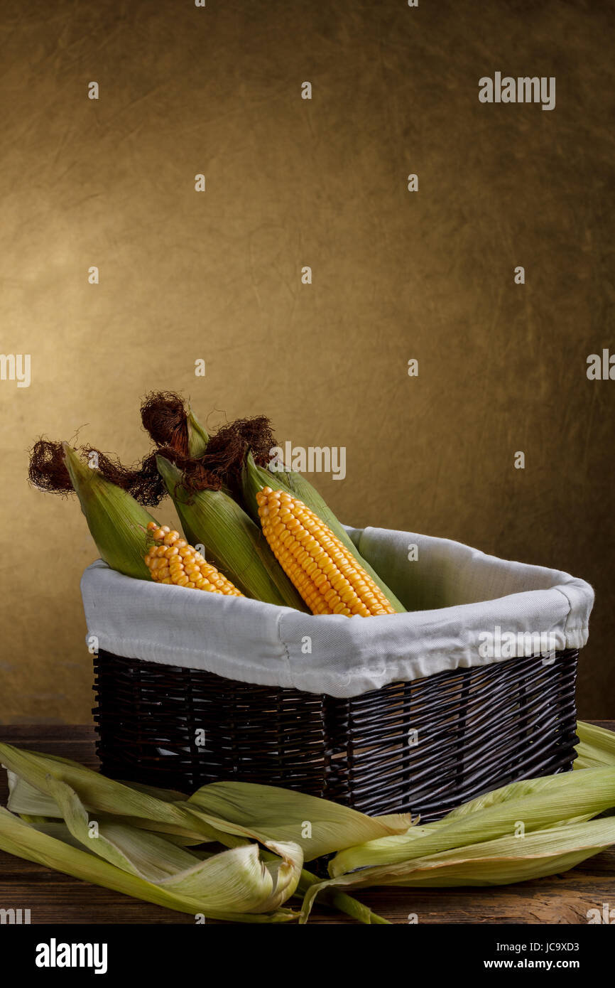 Ears of sweet corn in basket Stock Photo - Alamy