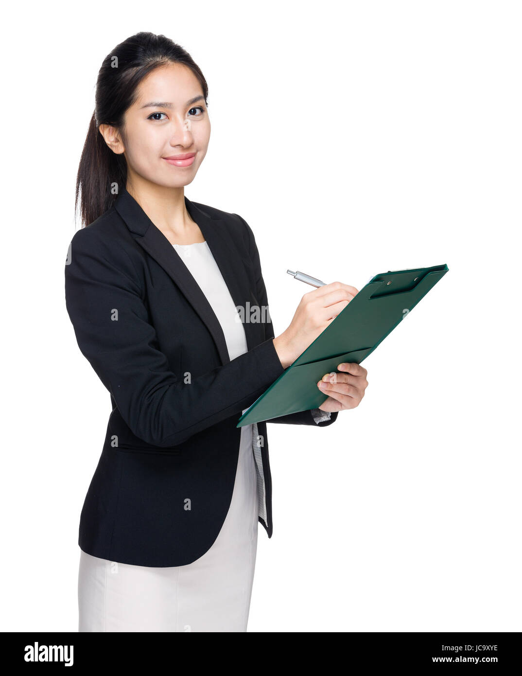 Business woman write down on clipboard Stock Photo - Alamy