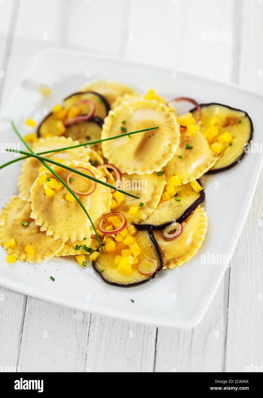 A serving of traditional Italian girasole ravioli served with roasted ...