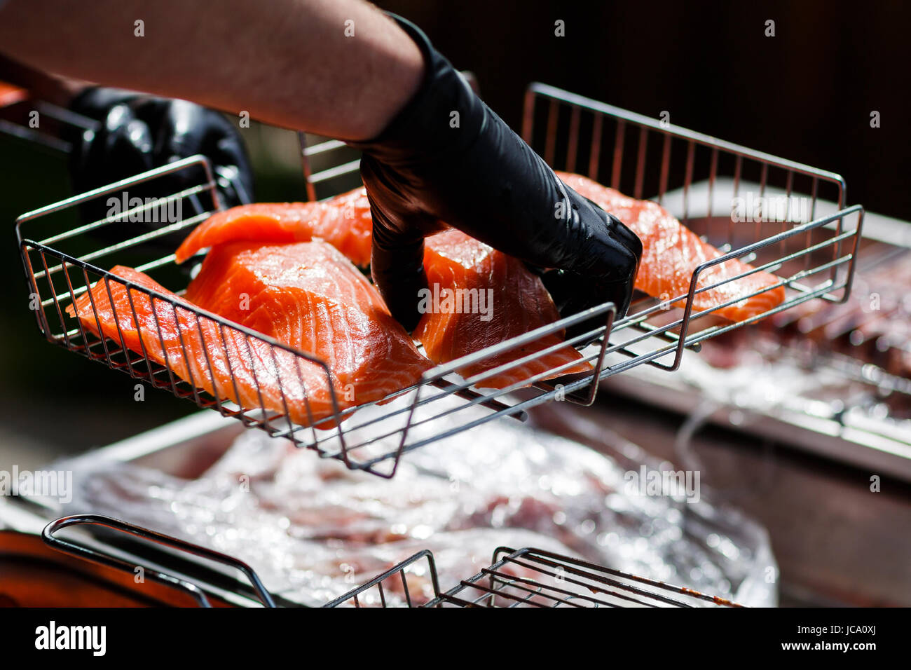 Cook preparing barbecue from fish Stock Photo - Alamy
