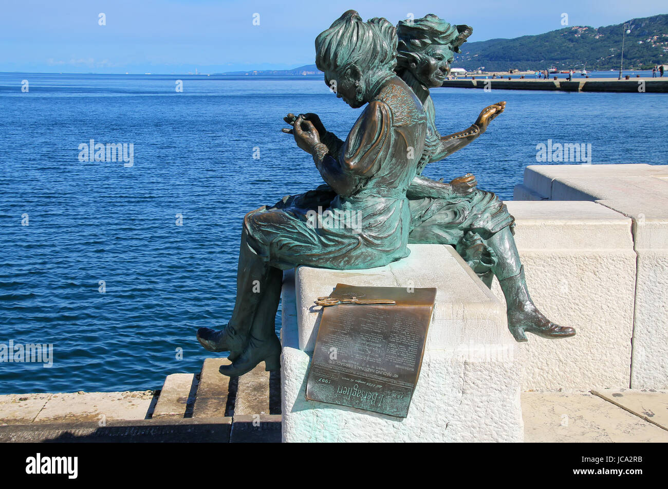 Le Sartine statue at Trieste waterfront in Italy. Trieste is the ...