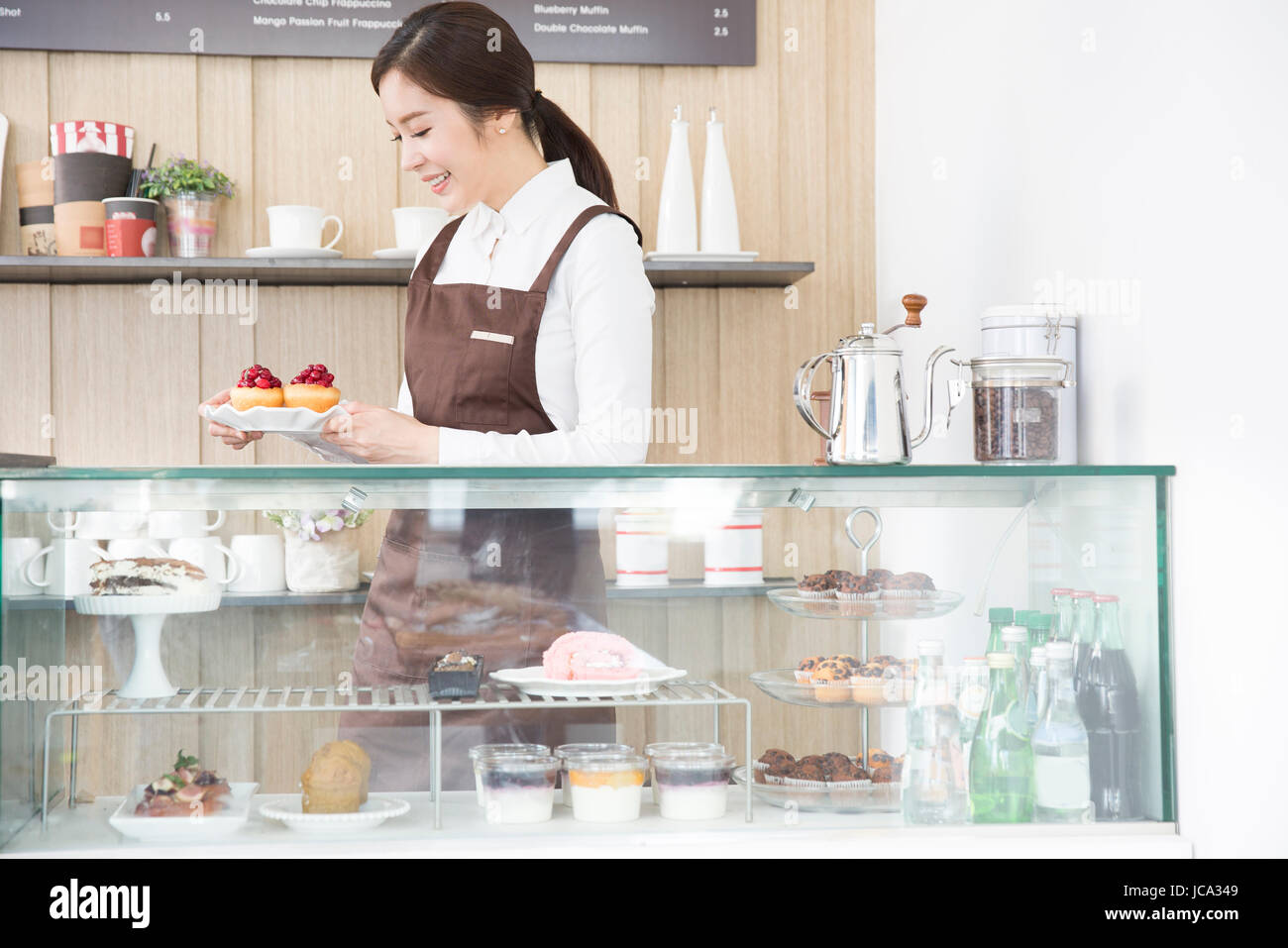 Female worker cafe hi-res stock photography and images - Alamy